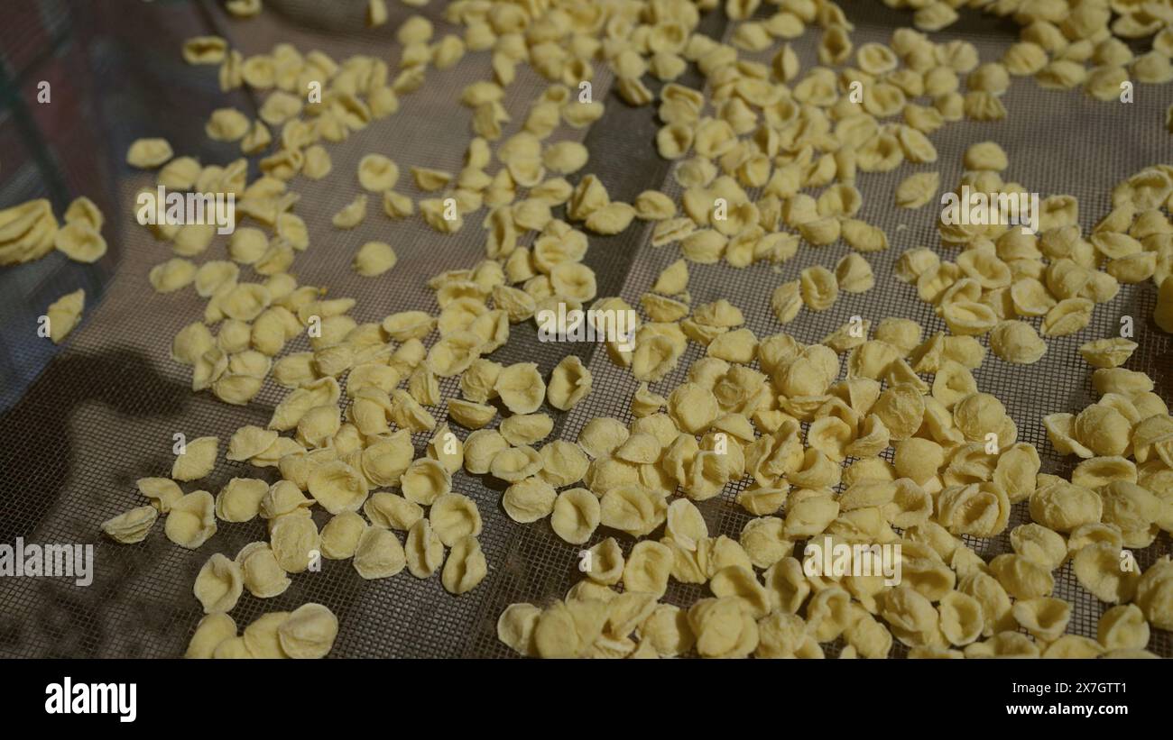 Orecchiette pasta drying outdoors in bari, puglia, italy, showing ...