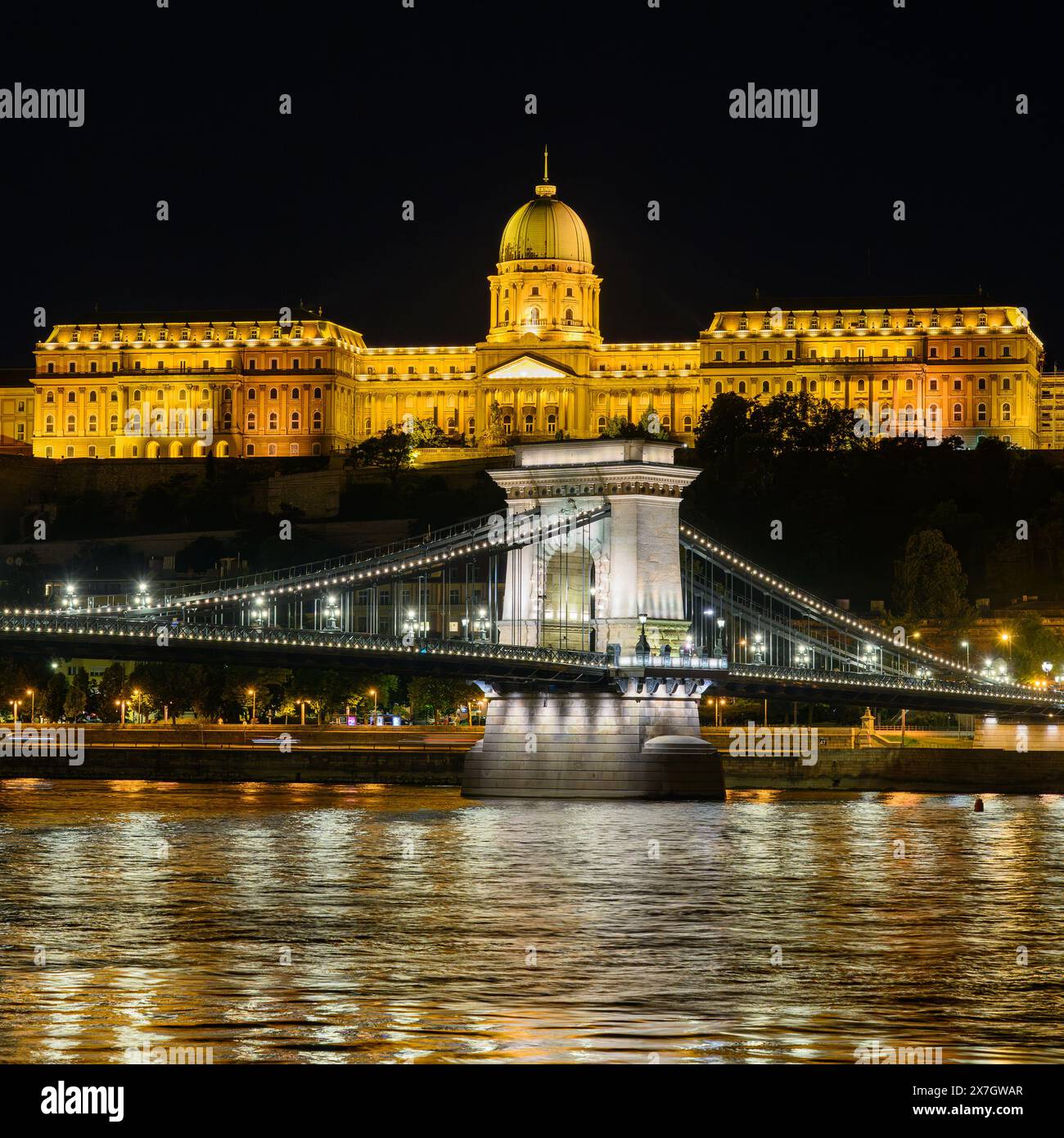 The illuminated Budapest Chain Bridge and Castle taken from distance at ...