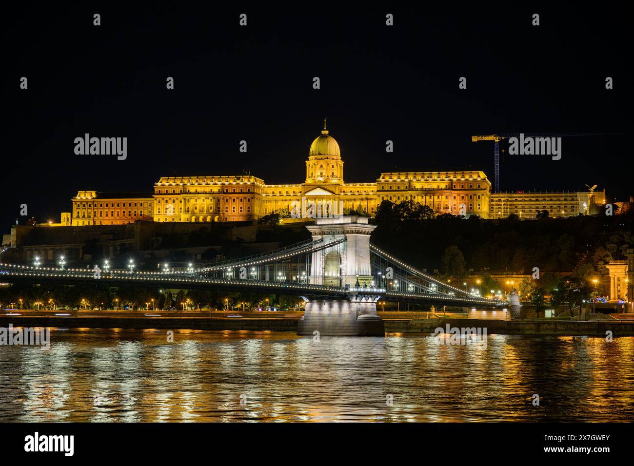 The illuminated Budapest Chain Bridge and Castle taken from distance at ...