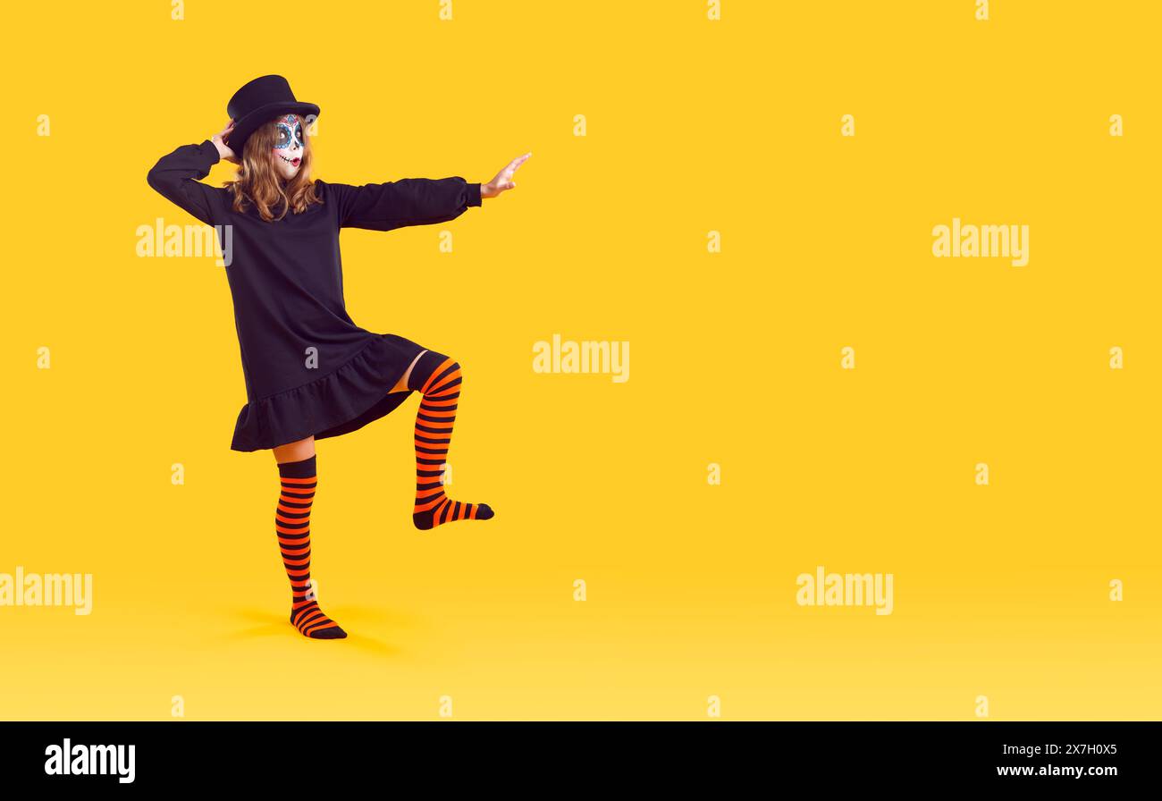 Woman in halloween costume with scary makeup dancing showing arm to ...