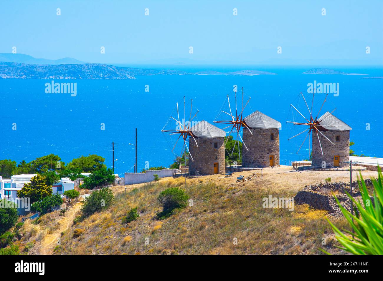 The three windmills of Chora and iconic Monastery of Saint John the ...