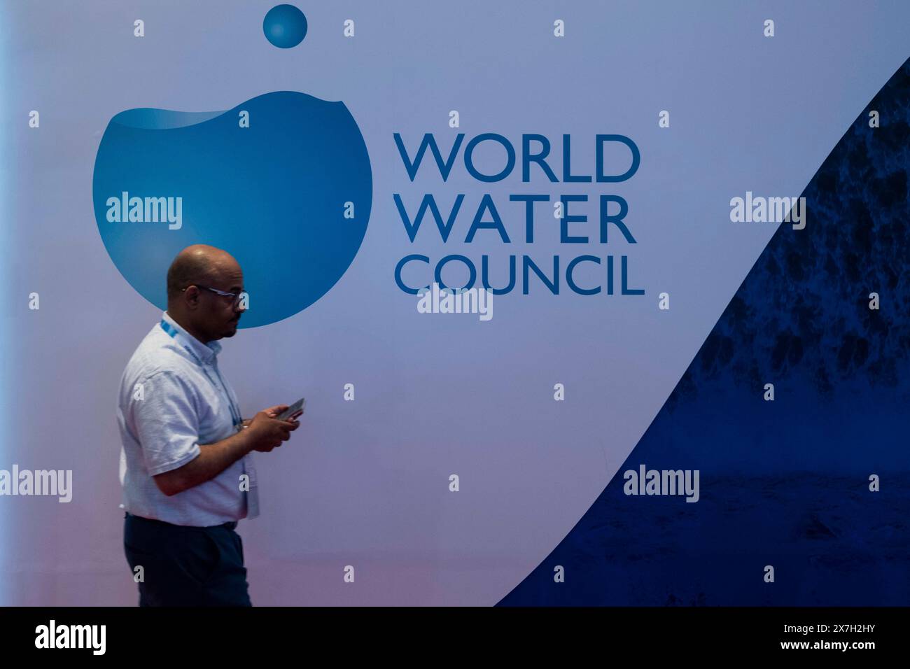 Bali, Indonesia. 20th May, 2024. A man walks past a sign of the World ...