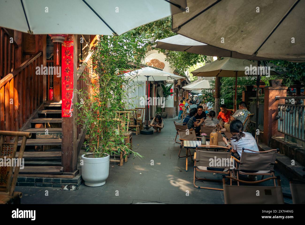 Lively Outdoor Cafe in Chengdu - China: People Enjoying Shade and ...
