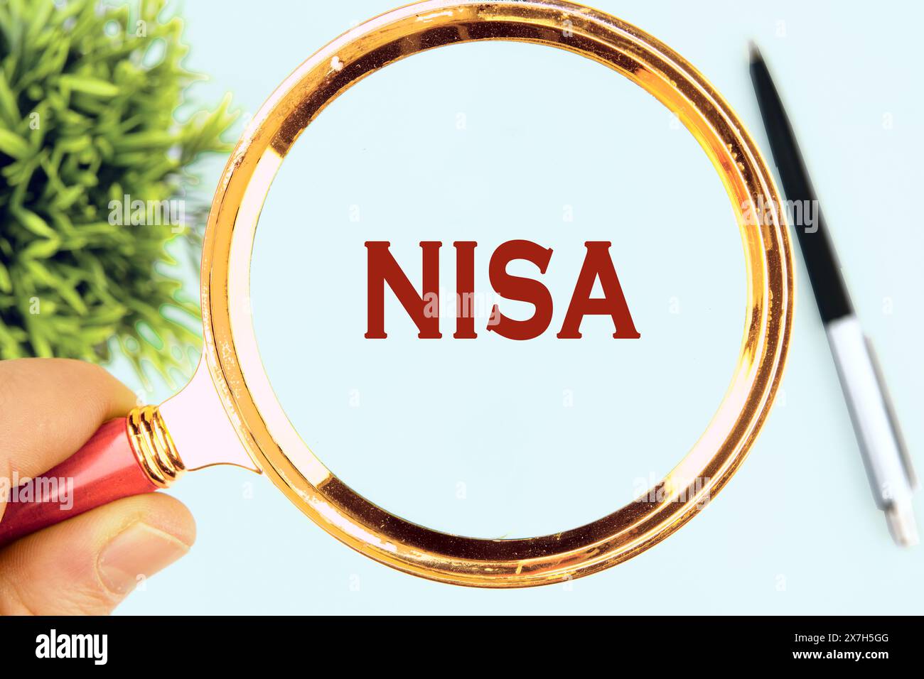 Image of NISA word written through a magnifying glass on a light ...