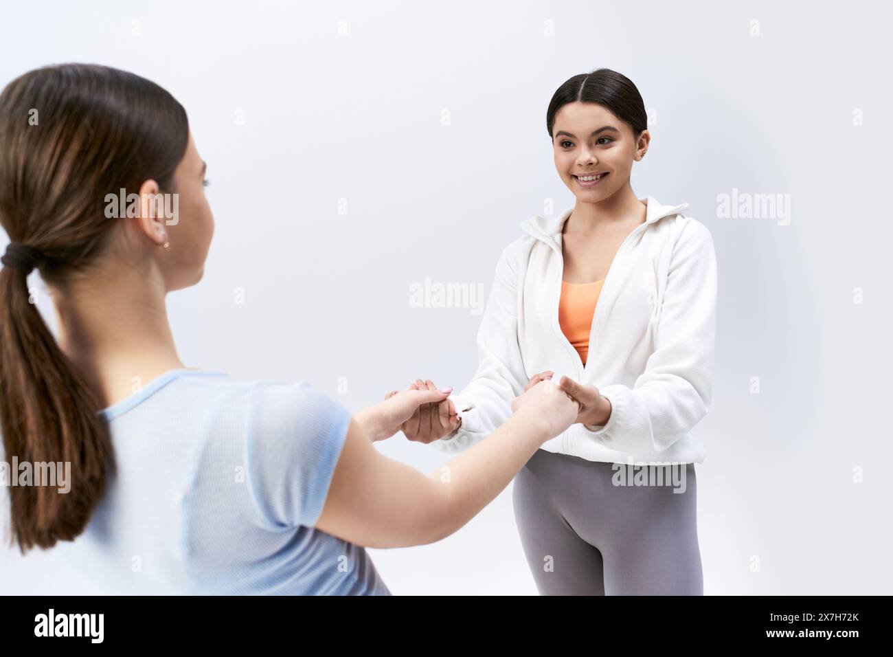 Girls teen handshake hi-res stock photography and images - Alamy