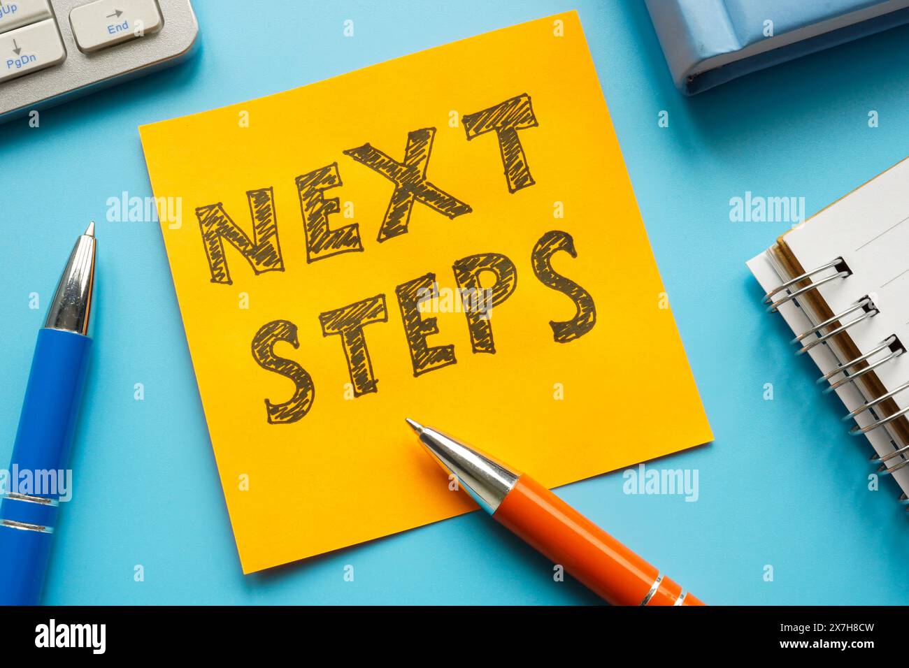 Paper sticker with words next steps as planning concept Stock Photo - Alamy