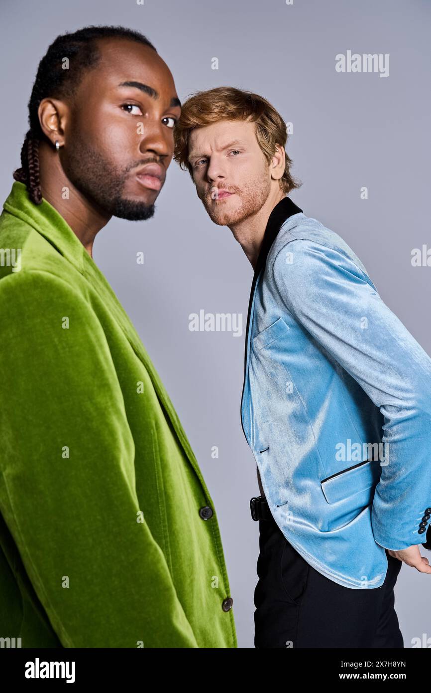 Two handsome multicultural men standing together in elegant, dapper ...