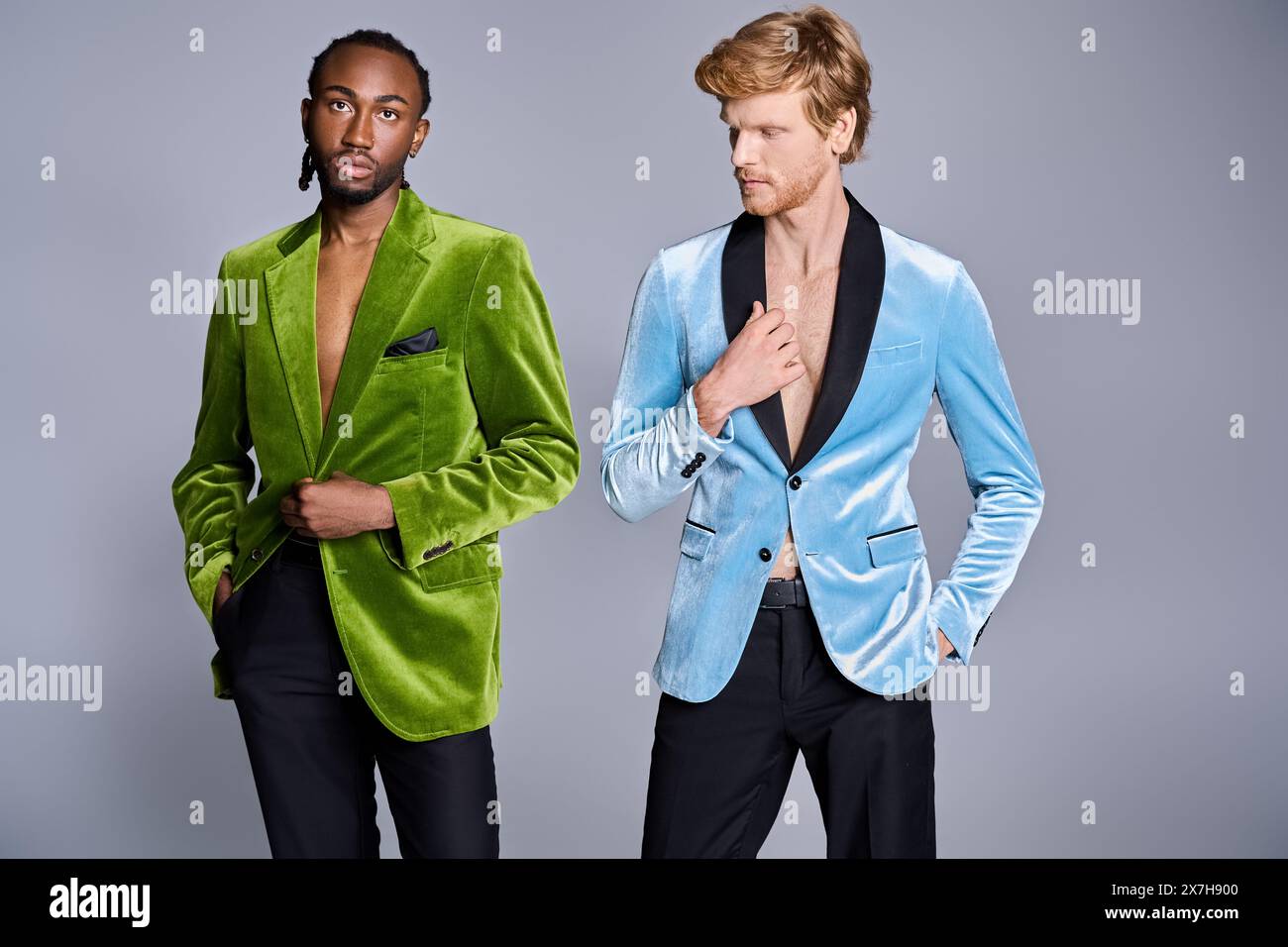 Two elegant, multicultural men in stylish suits pose together Stock ...