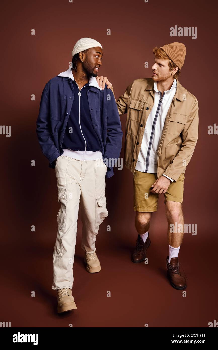 Two stylish young men of different backgrounds posing together Stock ...