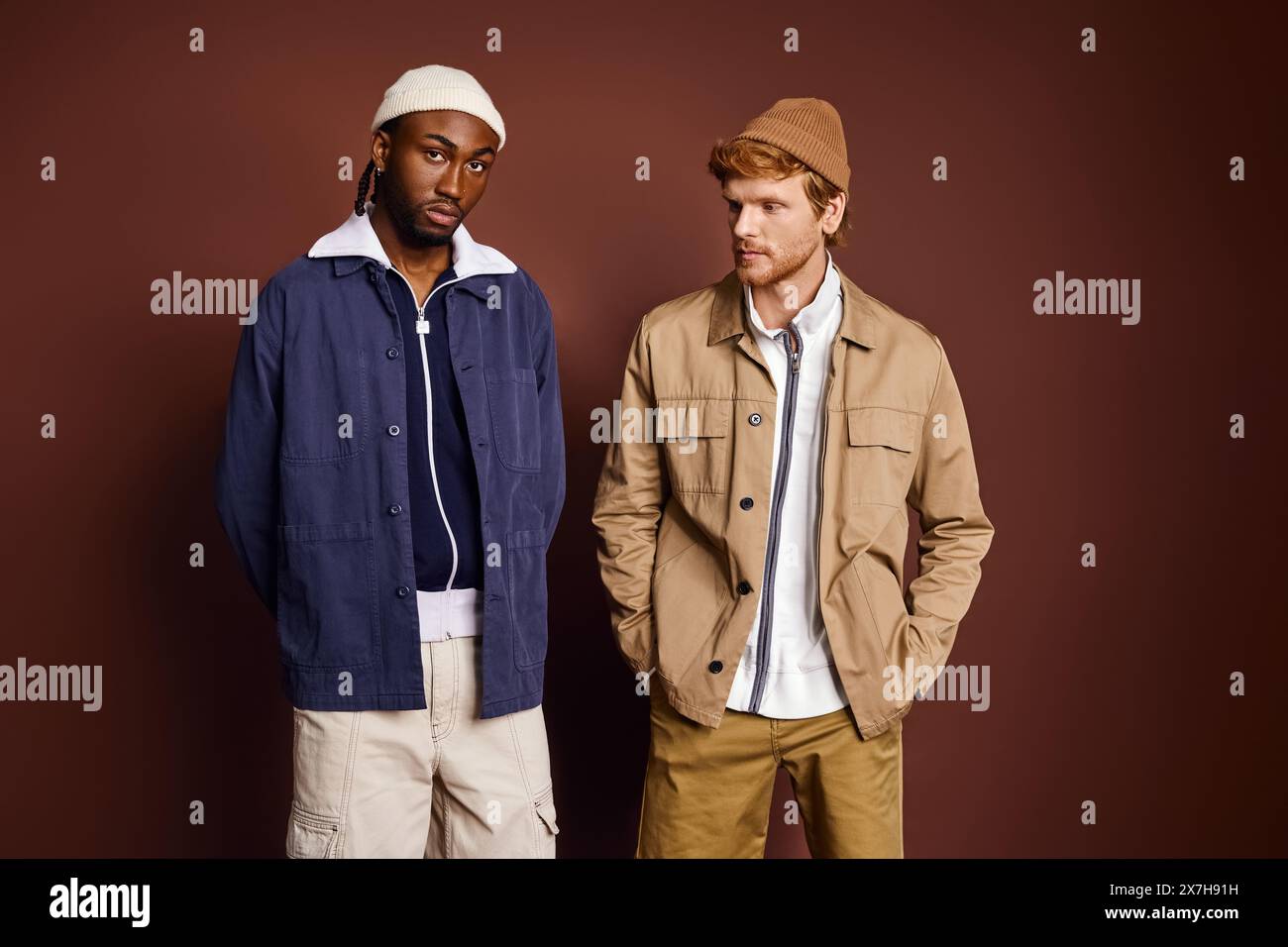 Two good-looking multicultural men pose together in stylish attire ...