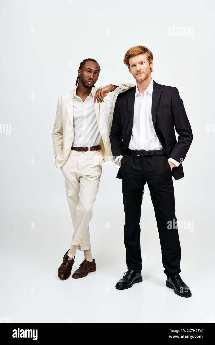 Two handsome multicultural men in stylish suits standing together Stock ...