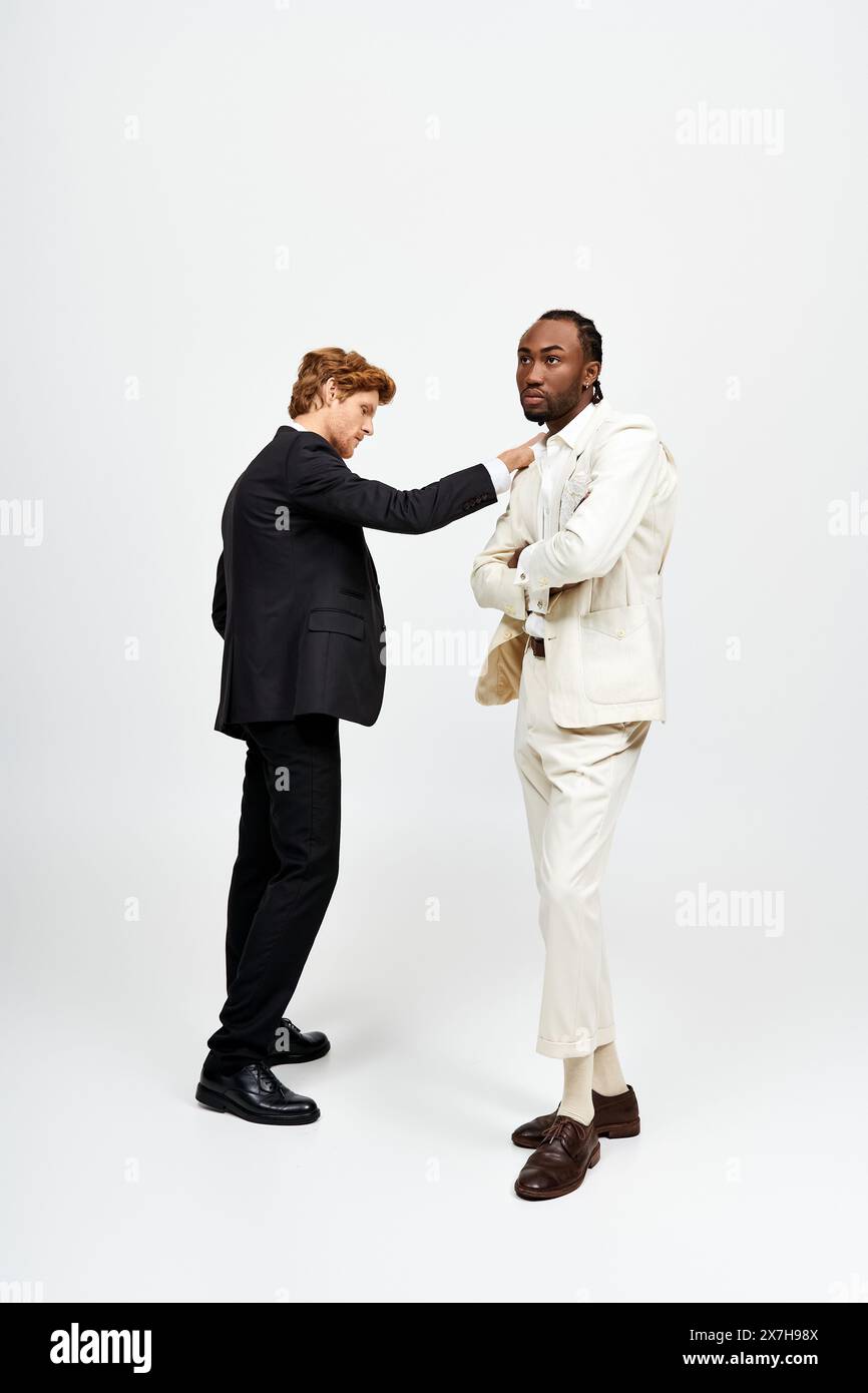 A multicultural men looking sharp in stylish suits Stock Photo - Alamy