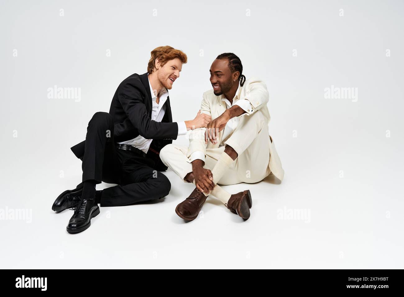 Two seated individuals hi-res stock photography and images - Alamy