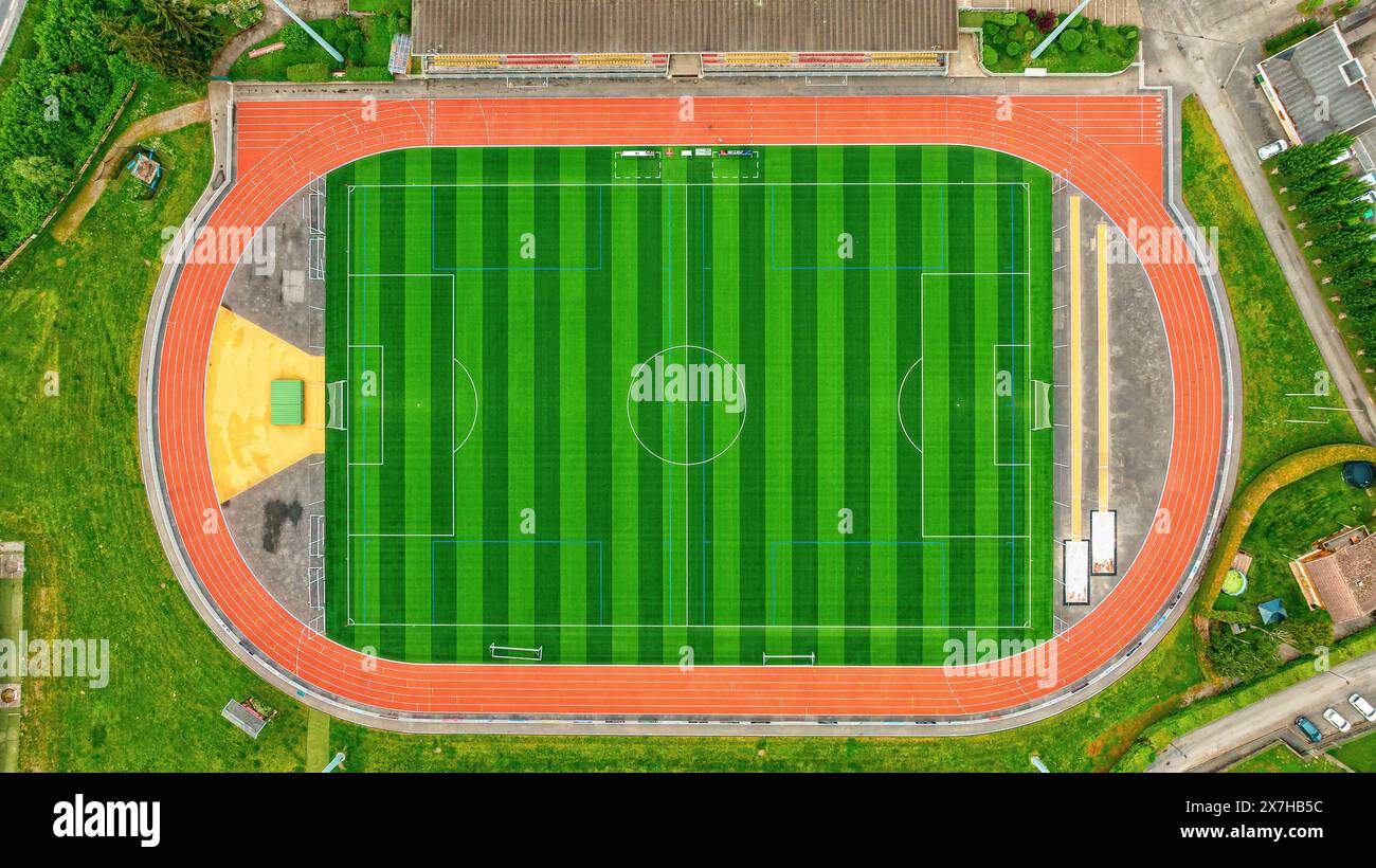 Aerial view of a stadium with running tracks. Green fields for football ...