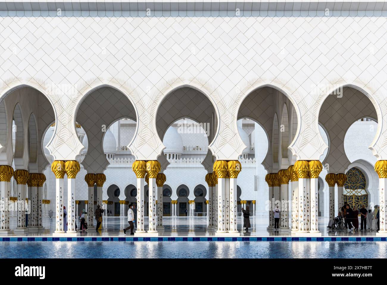 Abu Dhabi, UAE – January 4, 2024: Visitors stroll in the shadow of the ...