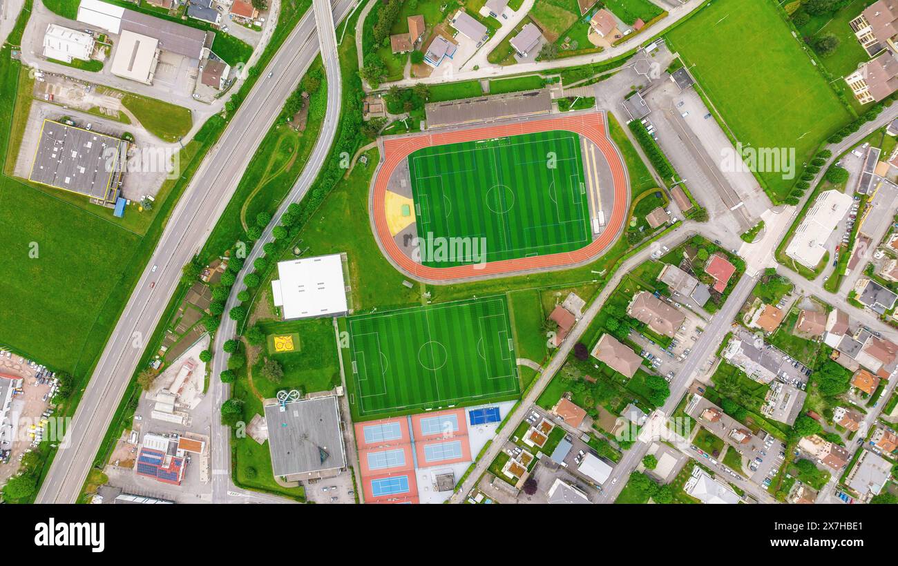 Stadiums in a small town from a bird's eye view. Green fields for ...
