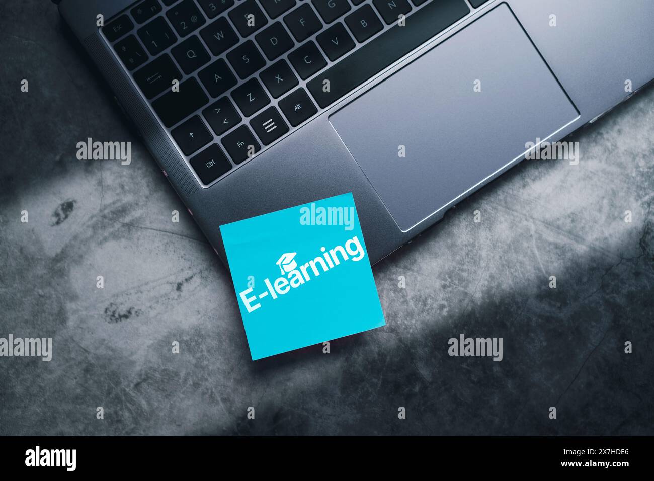 Blue adhesive note on laptop with online education concept. Distance ...