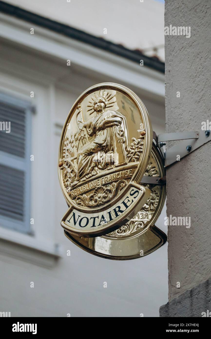 Cannes, France - 30 June 2023 : Notary sign hanging on the facade of a ...
