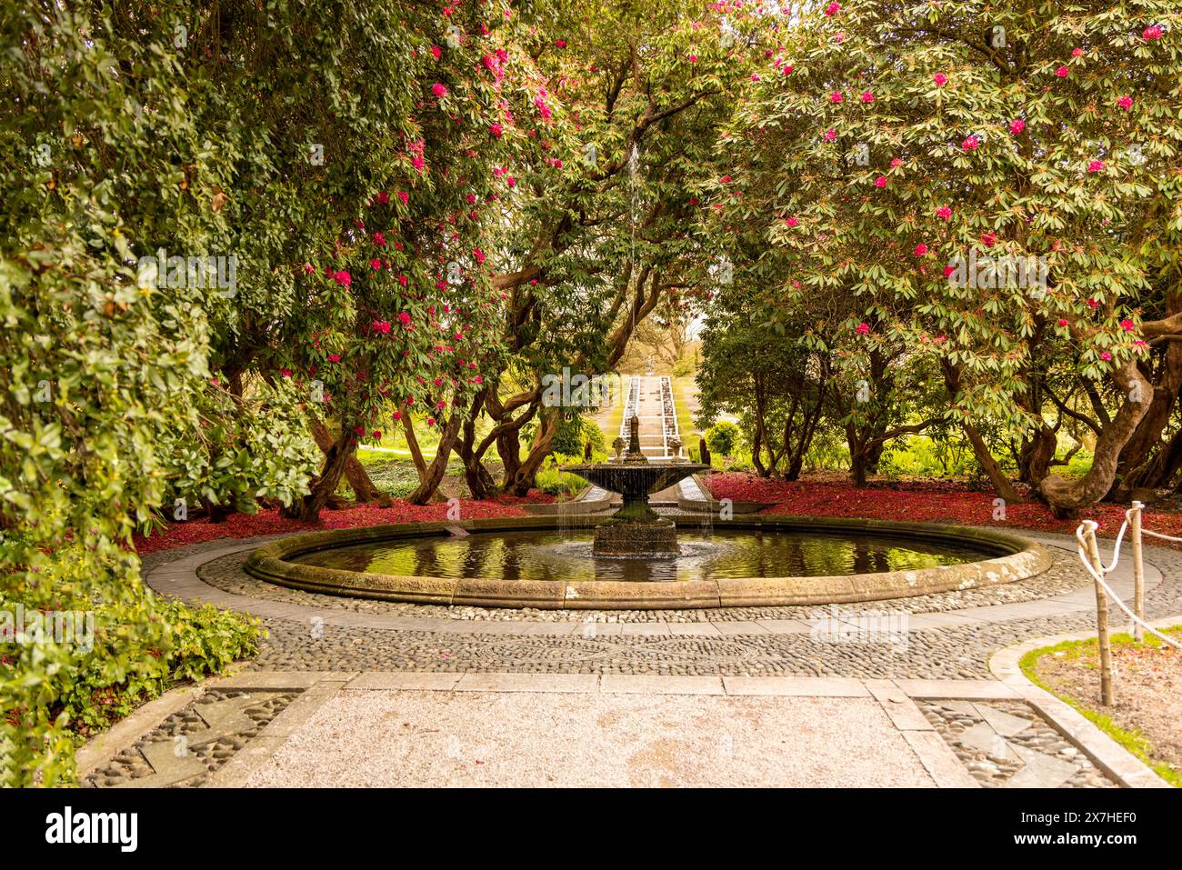 Holker Hall Formal Gardens with a flowing fountain and limestone ...