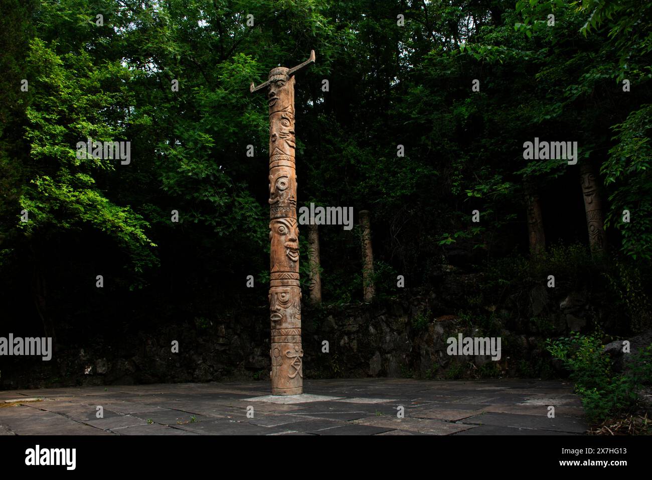 Totem wooden pole pillars carved with symbols or figures cultural ...