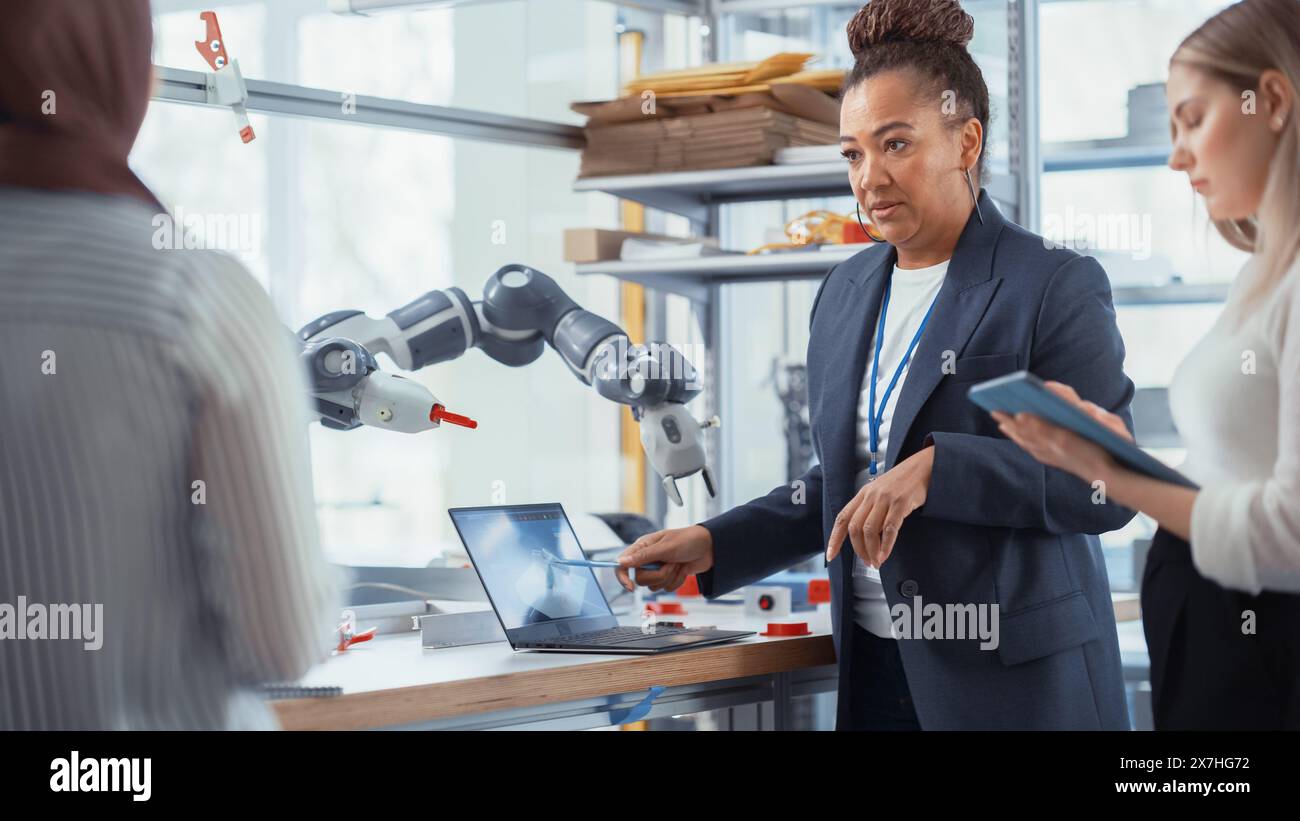 Black Senior Engineer Explaining Information to People That Look at ...