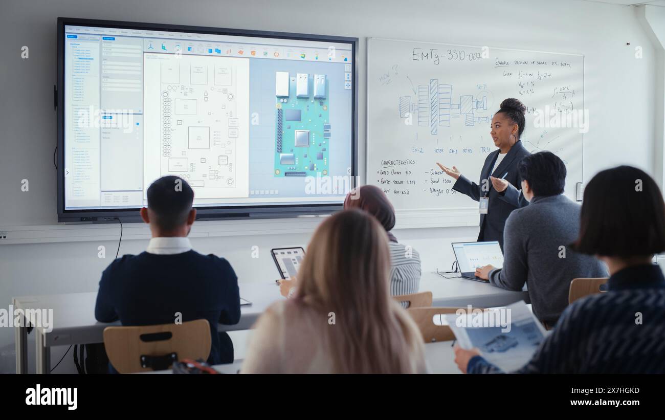 Black Female Teacher Using Digital Interactive Screen, Talks to Group ...
