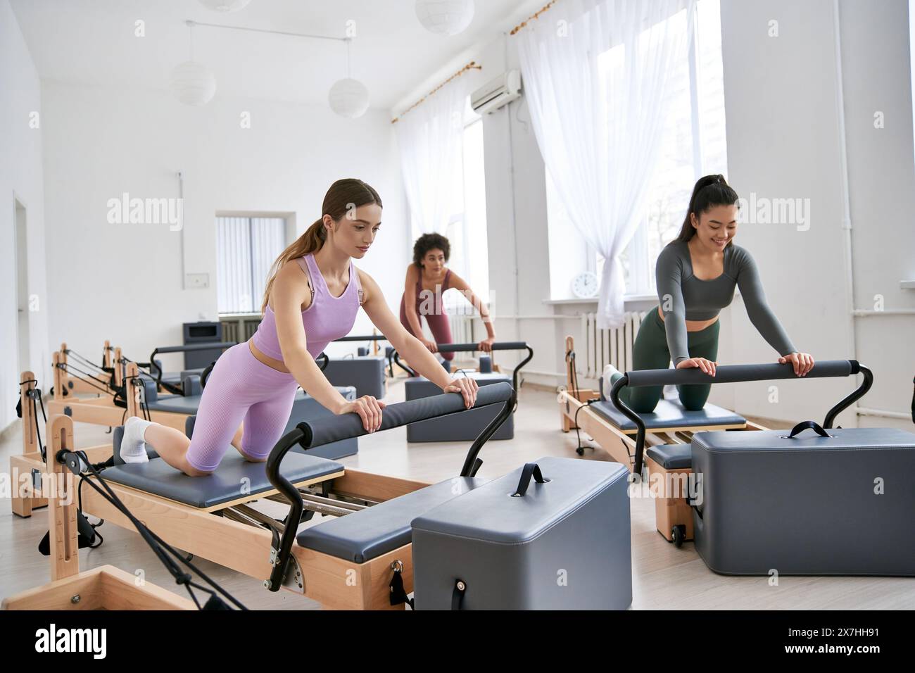 Group of women engaged in intense workout in gym setting Stock Photo ...