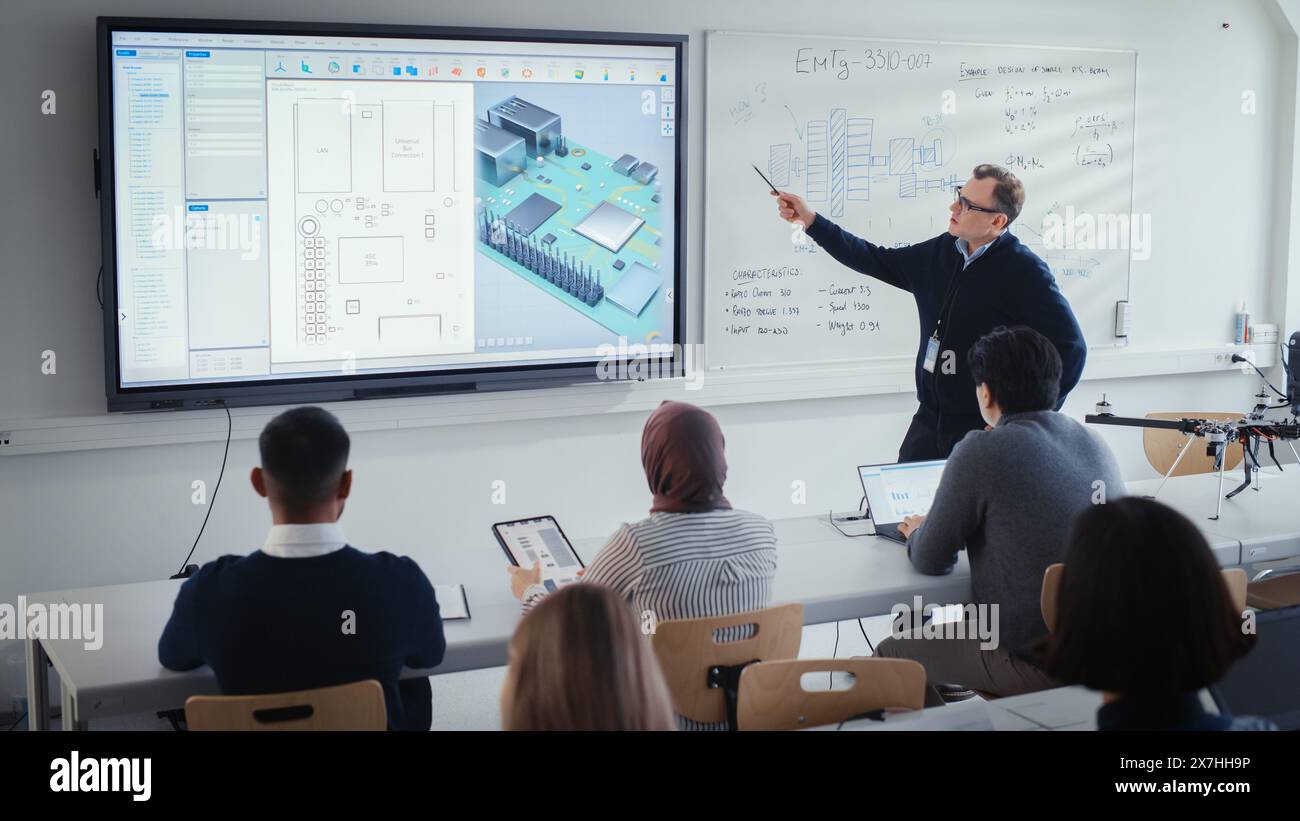 Male Teacher Explains About Computer Motherboard Components to Students ...