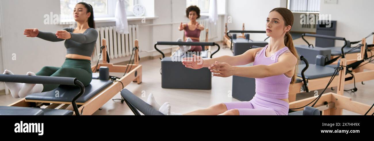 Group of women in a gym actively engaging in various exercises Stock ...