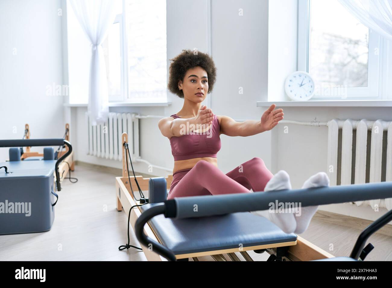 Woman focusing on exercise routine, pilates Stock Photo - Alamy