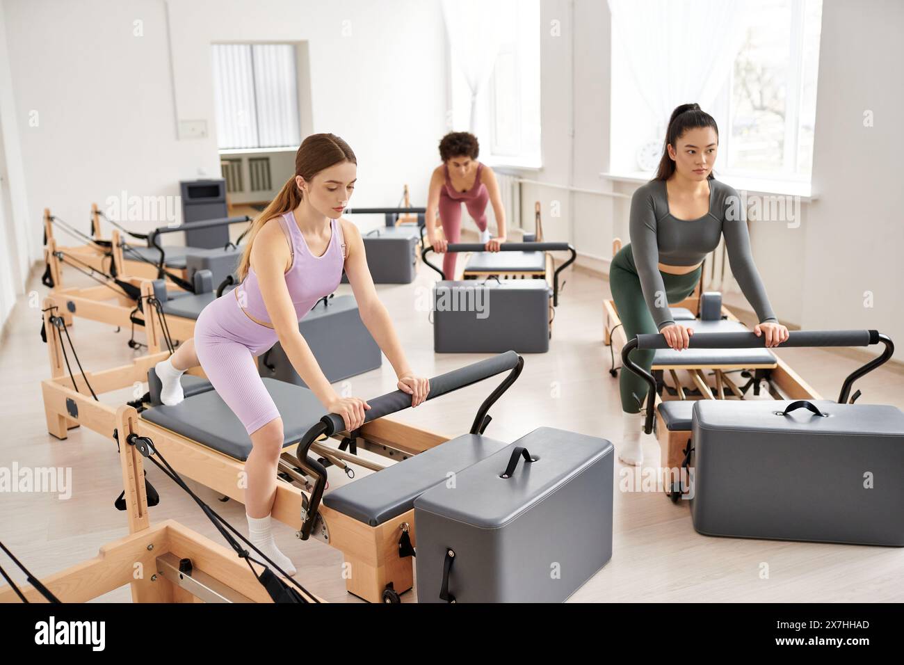 Diverse group of women exercising together in a vibrant gym setting ...