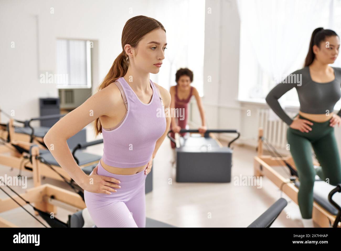 Diverse group of women standing confidently in a gym, ready for a ...