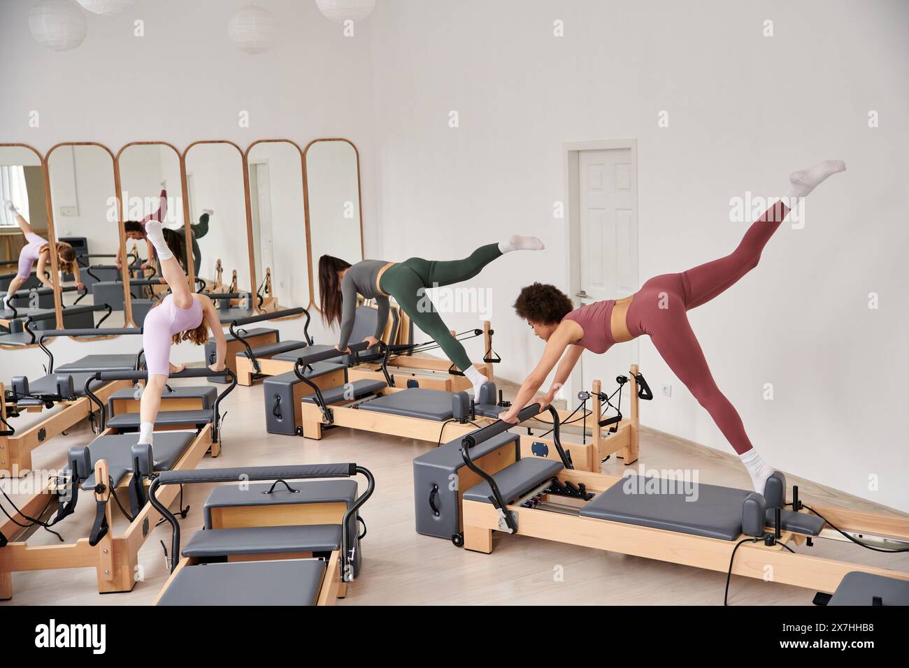 A group of pretty sporty women doing exercises in a gym Stock Photo - Alamy