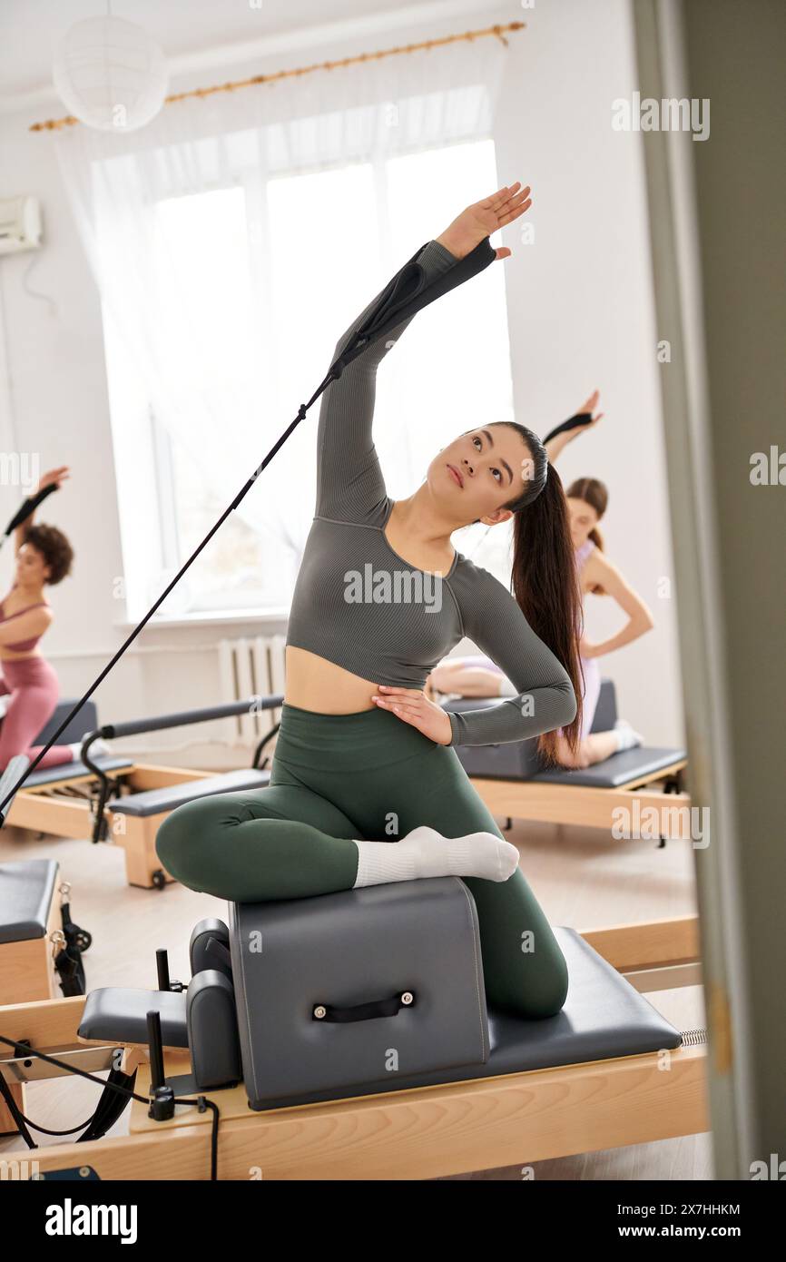 Active women engaging in a Pilates class, focusing on strength and ...