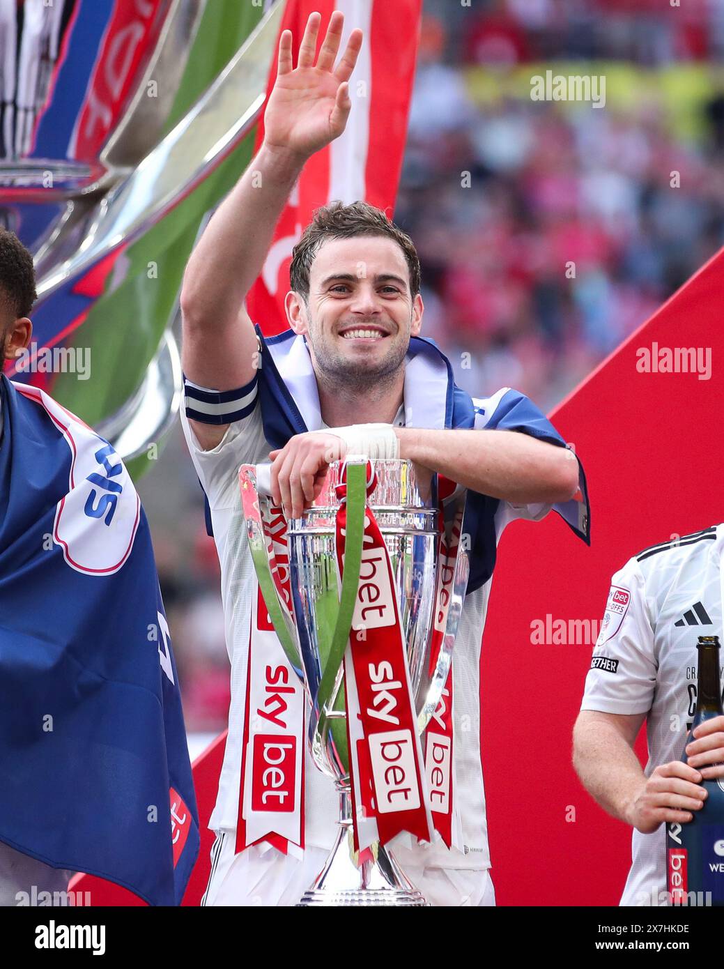 Crawley Town's Dion Conroy celebrates with the trophy after during the ...