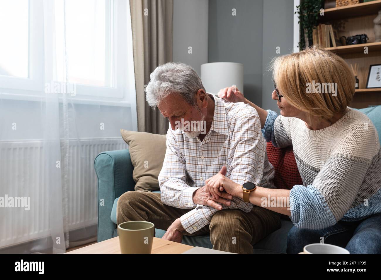 Simple living. Mature senior couple at home, woman emotional support to ...
