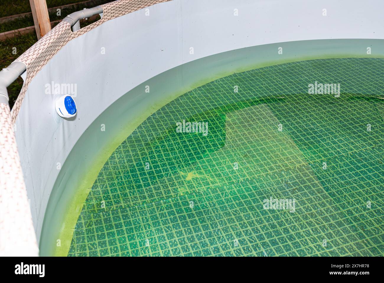 Emptying used water from a garden swimming pool using a home water pump ...