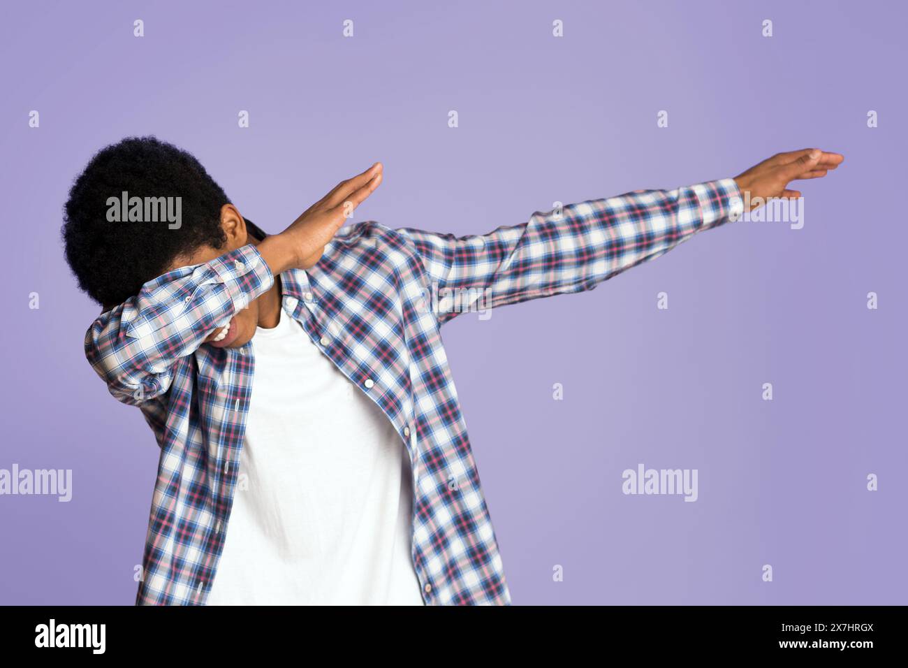 Black guy making dab gesture on pink studio background Stock Photo - Alamy