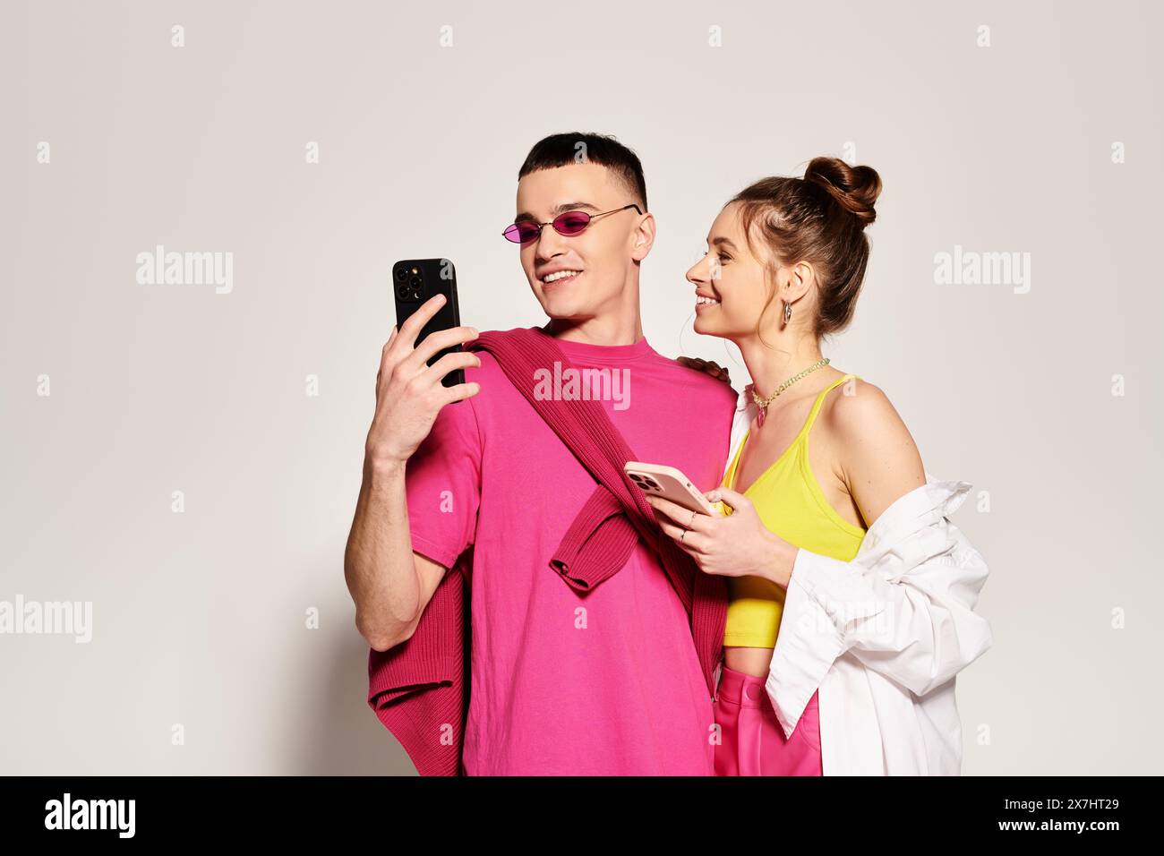 A stylish young man and woman stand together, radiating love and unity ...