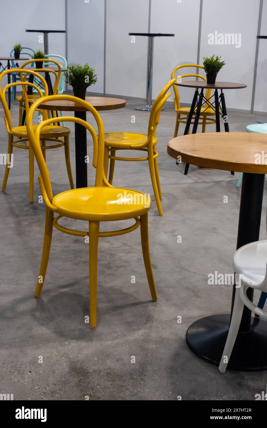 Colorful wooden chairs and tables in a public restaurant. Public places ...