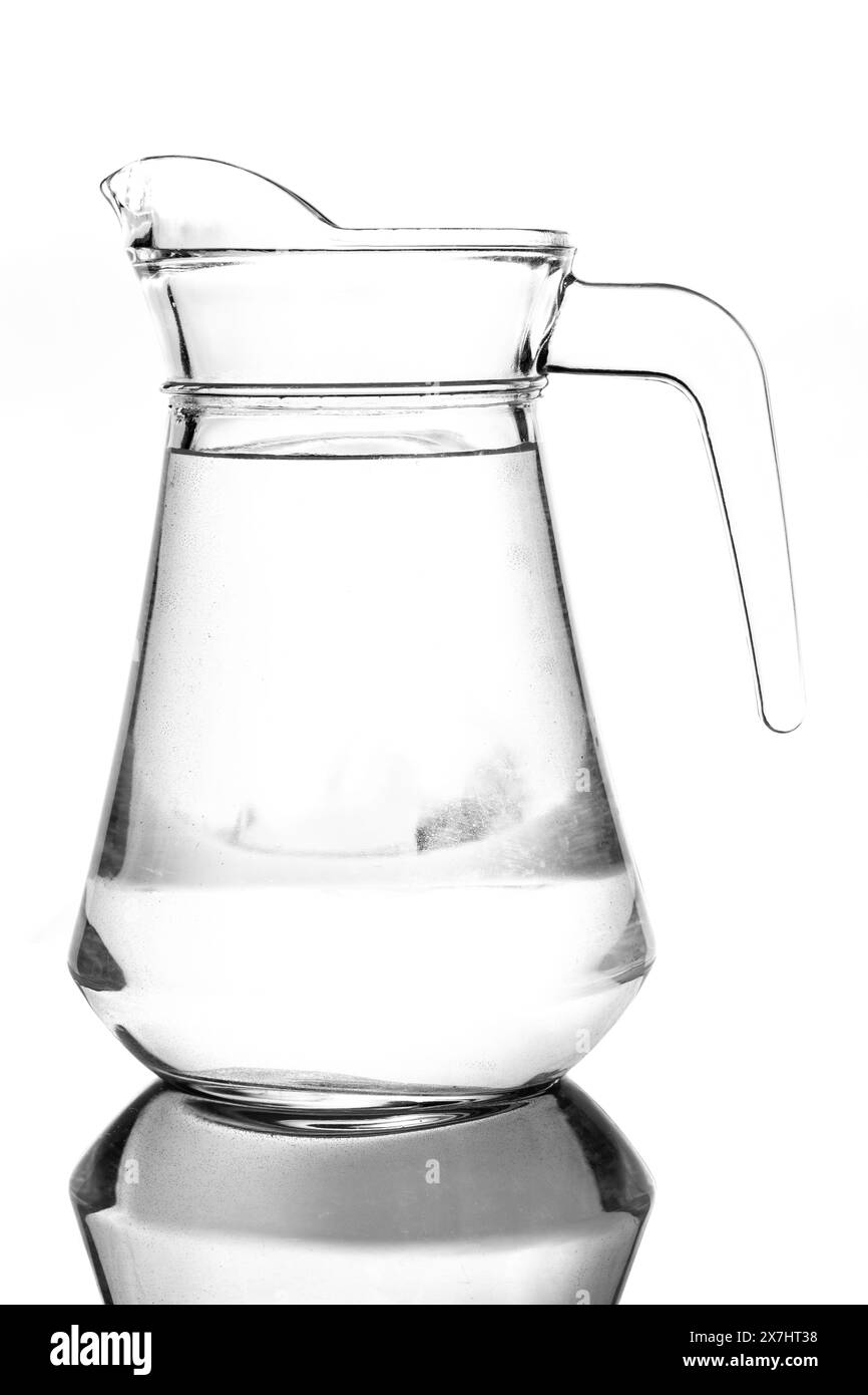 Transparent glass jug with clean water. A pitcher on a white background ...