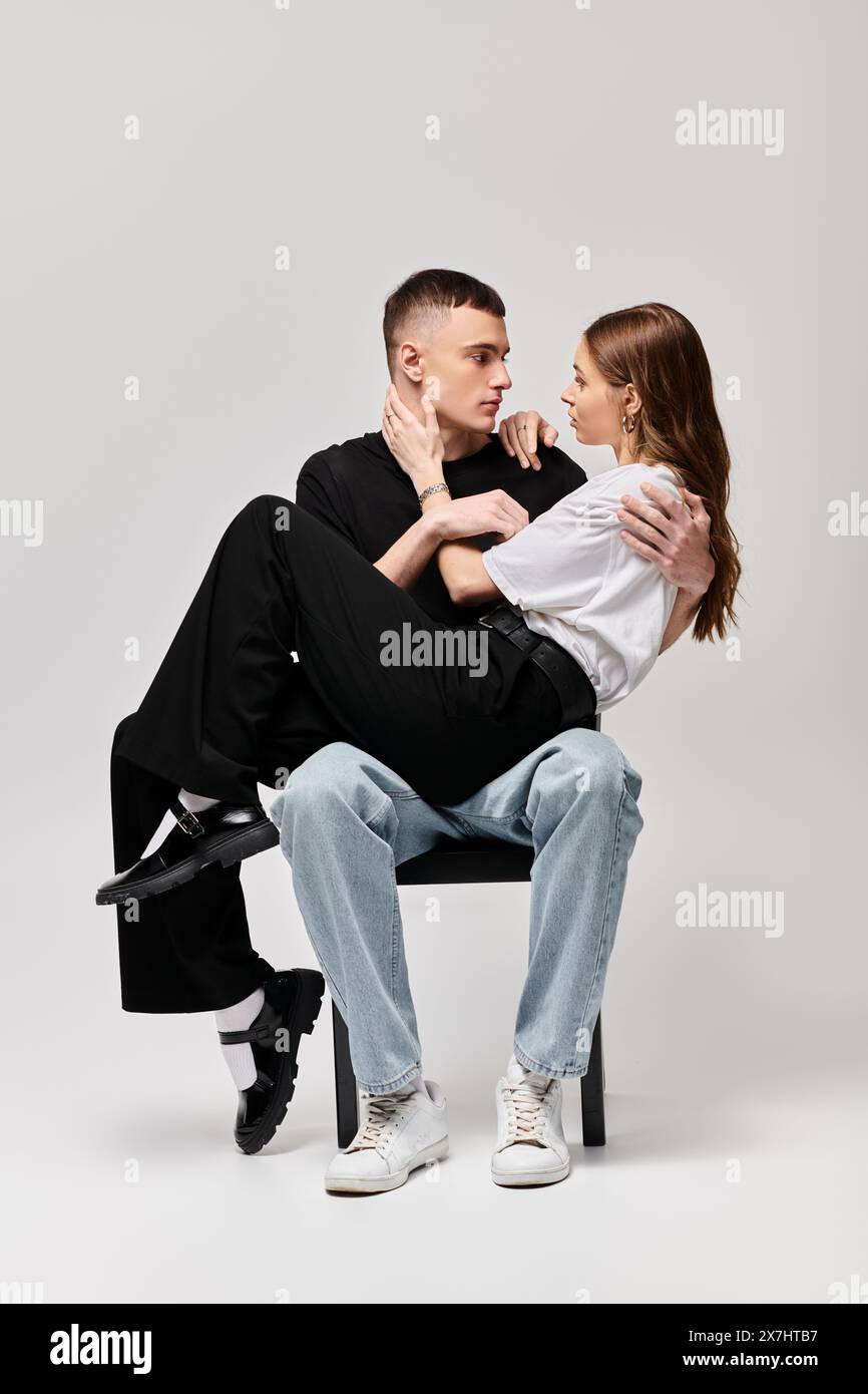 Romantic couple sitting on chair hi-res stock photography and images ...
