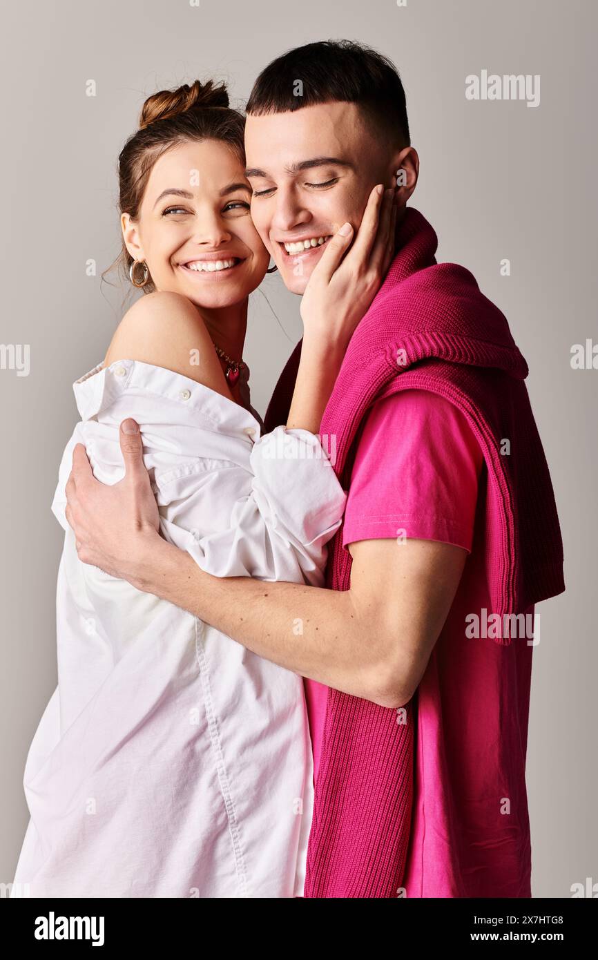 A stylish young couple in love, hugging each other with genuine ...