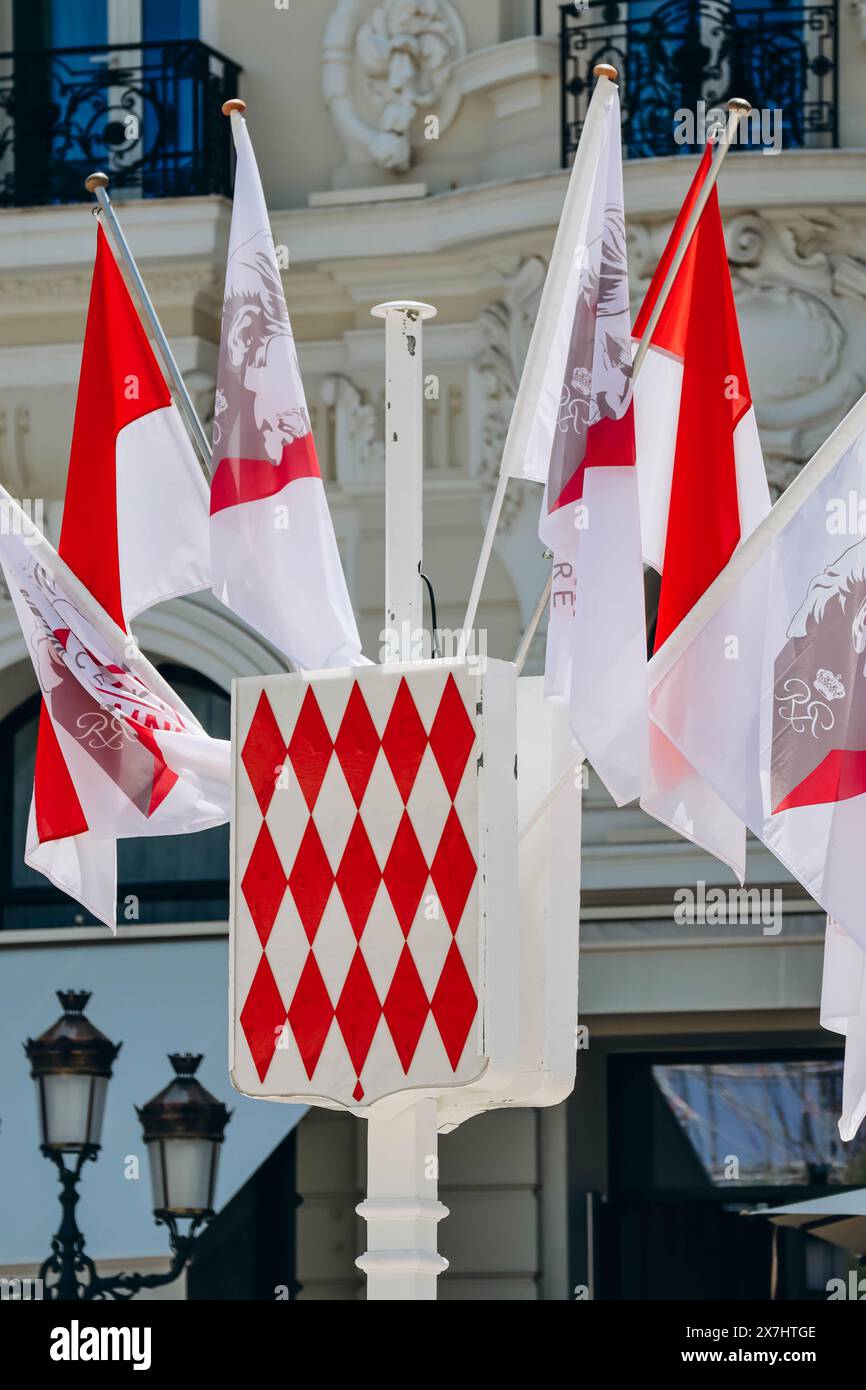 Monaco, Monaco - 25 June 2023: Coat of arms of Monaco, as well as flags ...