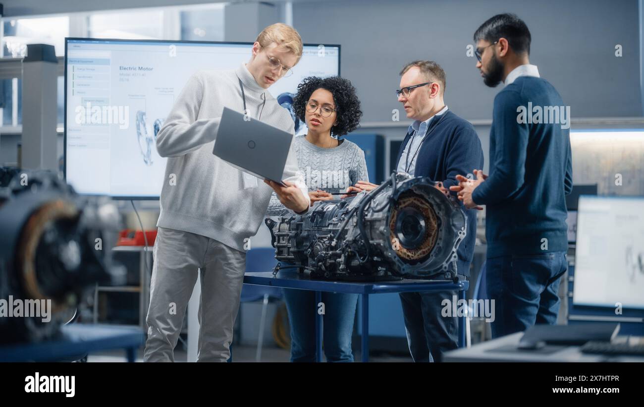 Diverse Group of Young Specialists Talk with Chief Engineer ...