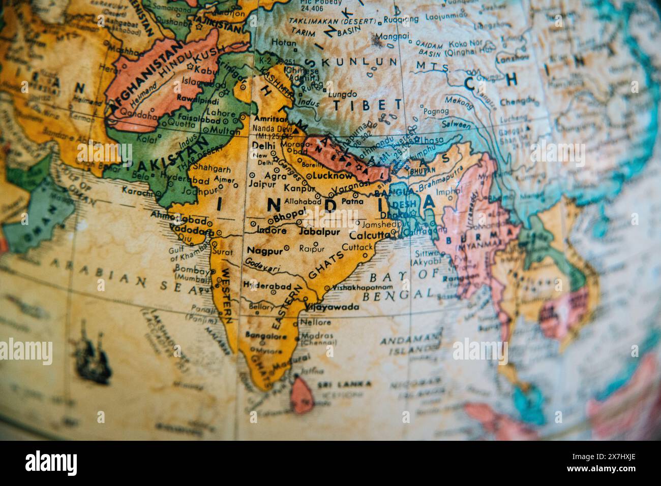 A detailed vintage globe map highlighting the geography of India ...