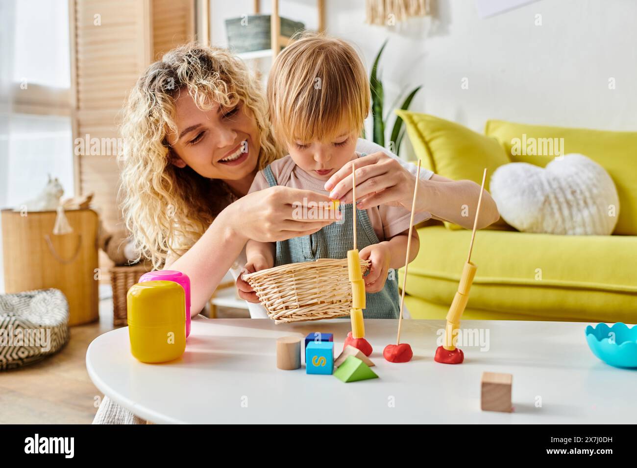 A woman and child happily engaging in the Montessori method of ...