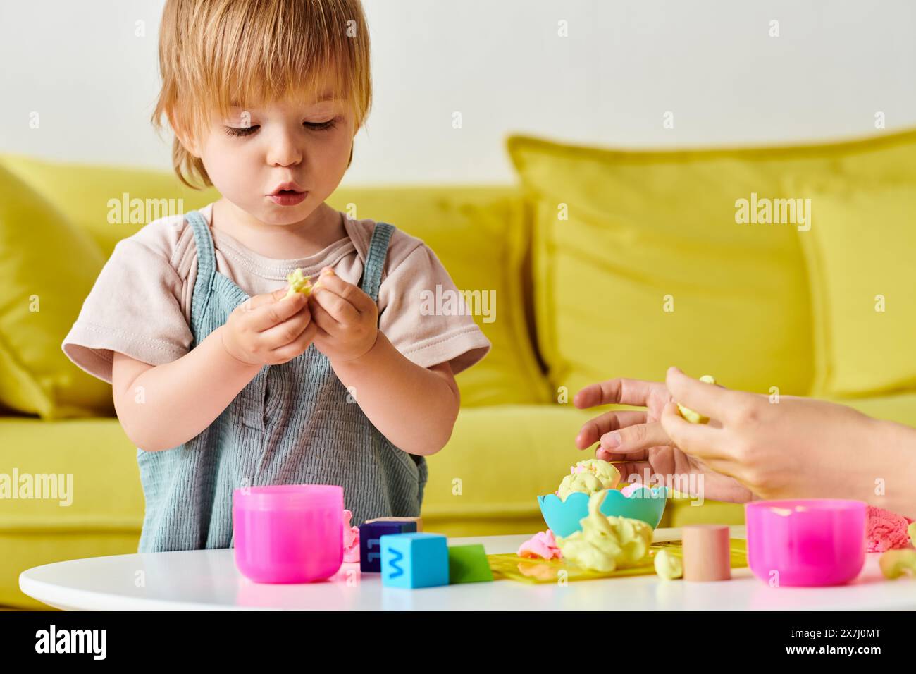 mother and her toddler daughter engage in Montessori play and learning ...