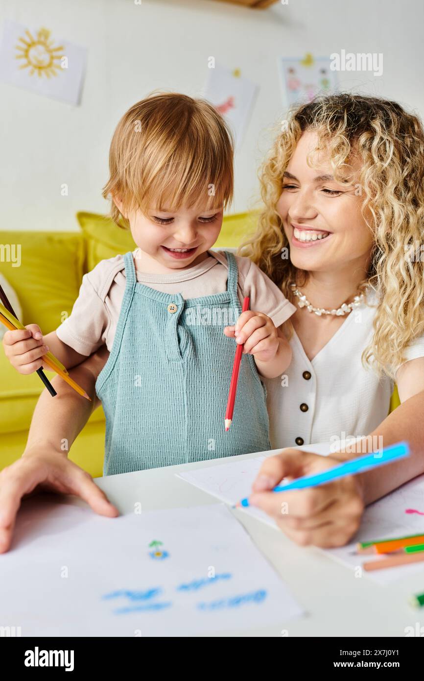 Curly mother and toddler daughter explore Montessori method, joyfully ...