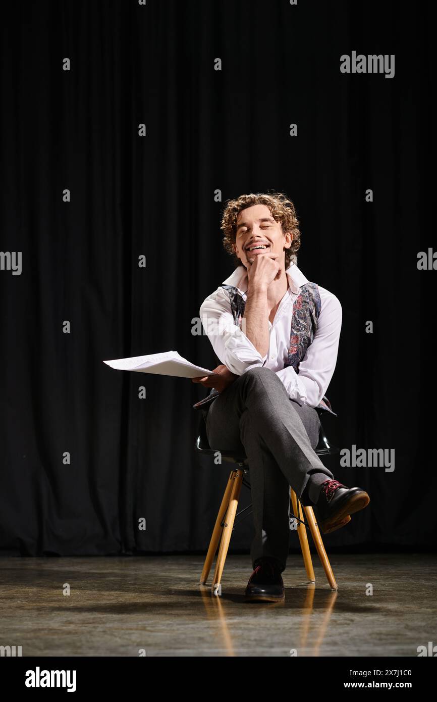 A man captivated by the contents of a paper while seated on a chair ...